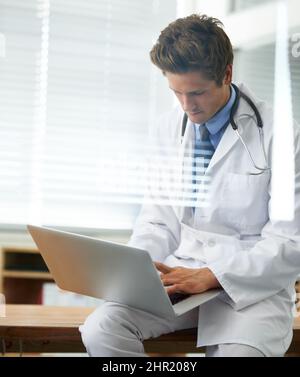 Doctor reading patient's diagnosis and examining medical test results ...