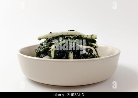 pickled green laver on a white background Stock Photo - Alamy