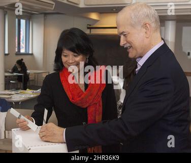 NDP Leader Jack Layton and his wife Olivia Chow make their way down the stairs of the campaign ...