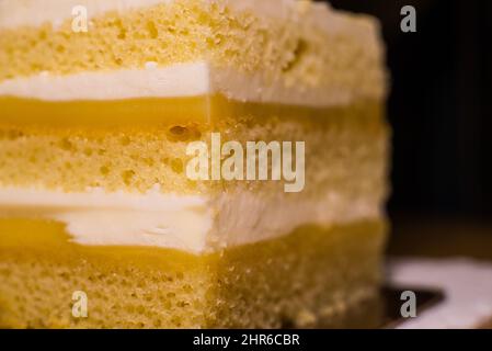 Close up of a piece of lemon in the glass tea pot on a wooden table ...