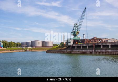 A crane at a scrap yard in the Cologne harbor industrial area NRW ...