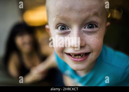 Alex Munro, 6, diagnosed with Autism Spectrum Disorder, gets a hug from ...