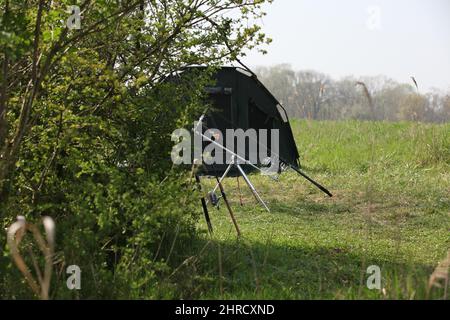 Carp tent on the grassy riverbank Stock Photo - Alamy