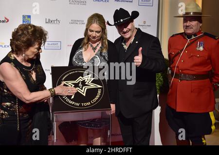 Lena Connors (left), the widow of Stompin' Tom Connors, kisses the late ...