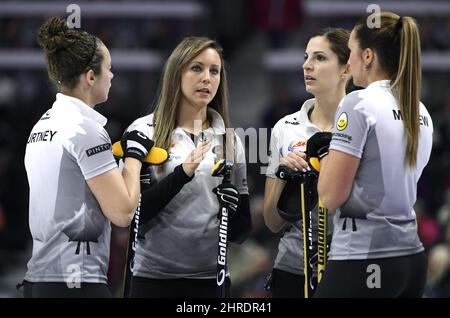Skip Rachel Homan, from Ottawa, Ont. kisses her husband Shawn Germain ...