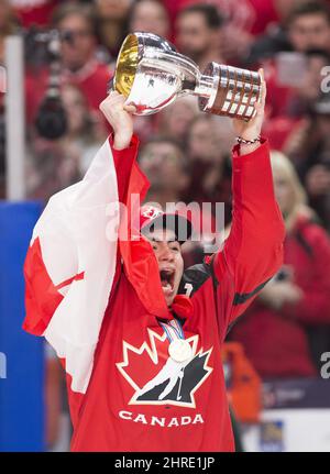 Canada forward Dillon DubÃ© (9) hoists the trophy after wining the gold ...