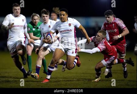 England's Cassius Cleaves gets away from Wales' Cameron Winnett during ...
