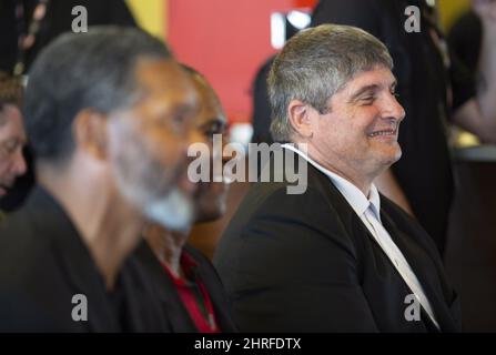 Former CFL player Less Browne, middle, smiles with fellow inductees ...