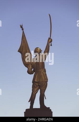 A vertical shot of an ancient statue in the park on a sunny day Stock ...