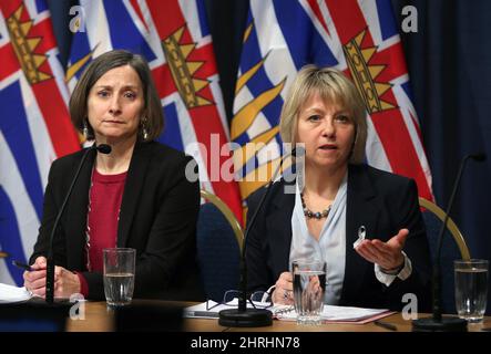 Chief coroner Lisa Lapointe (left) speaks as provincial health officer ...