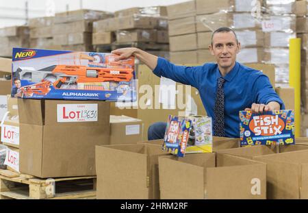 GCSurplus director general Nicholas Trudel poses with toys at a ...