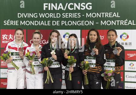 Ekaterina Beliaeva and Luliia Timoshinina of Russia perform a dive ...