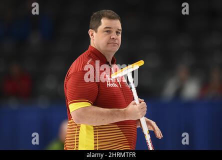 Team Nunavut skip Jake Higgs delivers the stone as he takes on Quebec at the Brier in Kingston ...