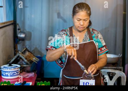 Female chef at Grand night market, which is one of several night ...