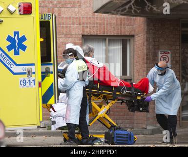 First responders transport a resident from a long term care facility ...