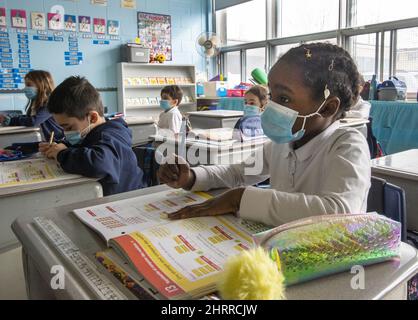 Grade one students wear masks as they attend class at Honore Mercier ...