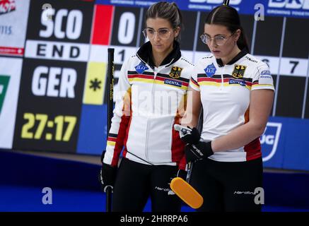 Germany skip Daniela Jentsch, left, looks on as Canada skip Kerri ...