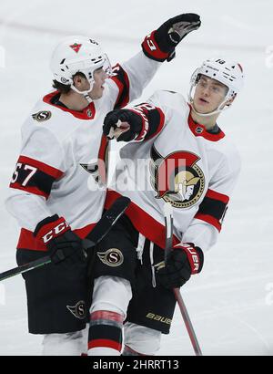 Ottawa Senators' Shane Pinto (57) battles Boston Bruins' Trent Frederic ...