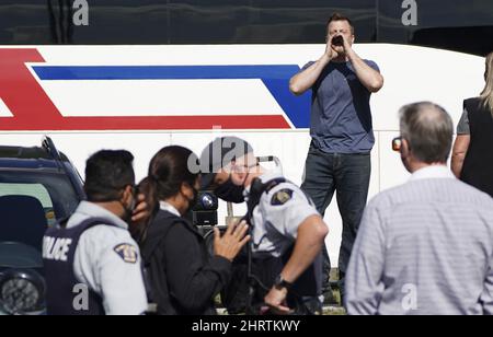 A lone protester heckles Liberal leader Justin Trudeau as he takes part ...