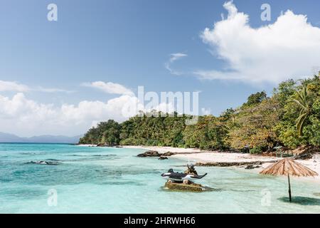 Landscape of the Bon Bon Beach surrounded by hills and sea in Romblon ...