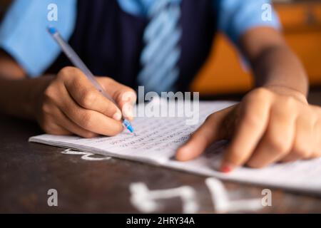 Indian School Girl Student Writing Note Book Studying In Class Stock ...