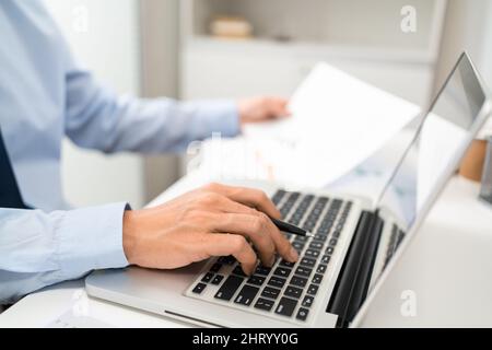 Working Man Conept The man sitting in front of the computer laptop at ...