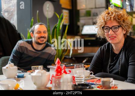 Two amazing and beautiful businesspeople are smiling while talking ...