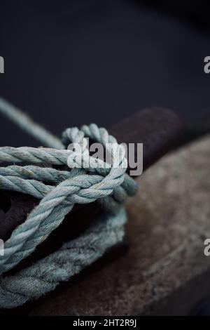 Vertical shot of a bollard on a port near a city Stock Photo - Alamy