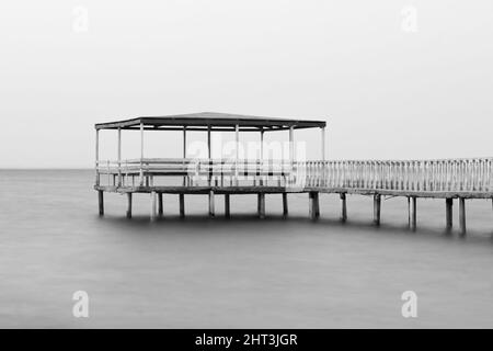 Greyscale shot of the sunset over the sea Stock Photo - Alamy