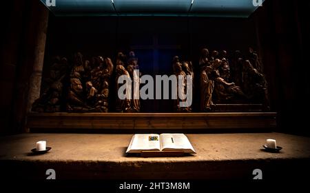 Open Bible in front of Christ Cross, candles, Evangelical St. John's ...