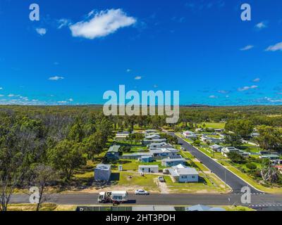 Aerial View of the town of Gilgai surrounded by green rainforests in ...