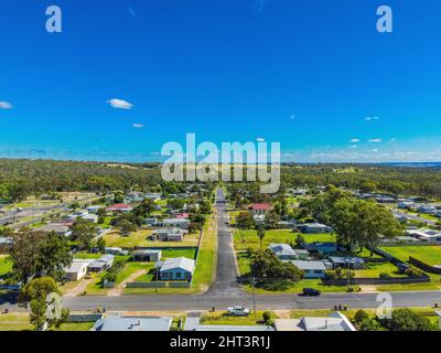 Aerial View of the town of Gilgai surrounded by green rainforests in ...