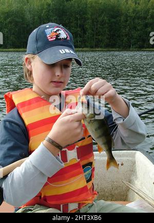 boy with perch Stock Photo - Alamy