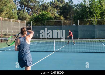 Caucasian woman taking tennis lesson on a sunny day Stock Photo - Alamy