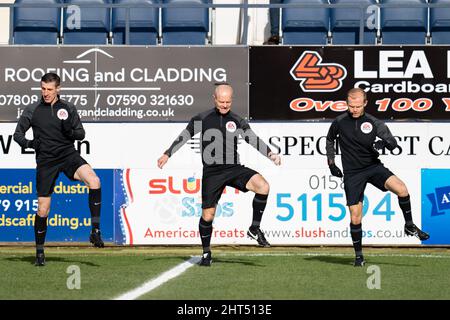 Referee Andy Woolmer (C) and Assistant referee Adrian Waters and James ...