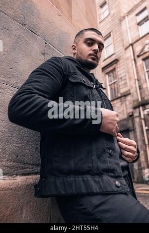 Vertical shot of a cool stylish Pakistani male posing in a street Stock ...