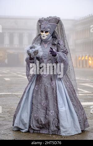 venice, italy, 24 feb 2002, people in colorful costumes at the carneval ...