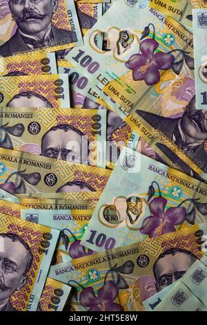 Closeup shot of a 100 leu banknotes stack isolated on black background ...