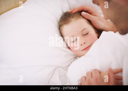 Young girl tucked in bed Stock Photo - Alamy