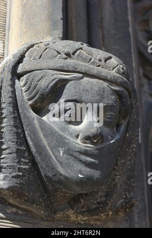 Majestic medieval stone face of a young man with a strong Gothic ...