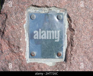 metal plate on granite stone in park at dry sunny summer day Stock ...