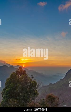 The sunrise sky and the morning mist at the Adam's Peak, Sri Lanka ...