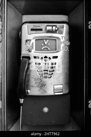 Grayscale of an old telephone outside Stock Photo - Alamy