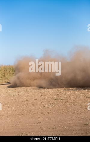 Rally car raising dust while racing on a desert Stock Photo - Alamy