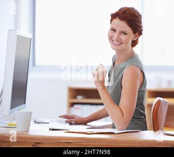 Young redhead woman working as manager at retail boutique praying with hands together asking for ...