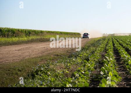 Car raising dust on a rural field Stock Photo - Alamy