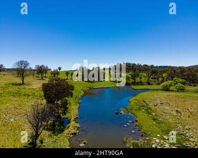 View of a big green field of the Beardy River with beautiful blue sky ...