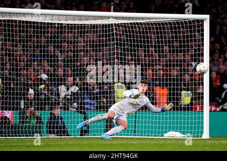 Chelsea goalkeeper Kepa Arrizabalaga makes a save with his legs during ...
