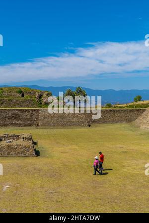 Zapotec temples with tourists inside the Monte Alban archaeological ...