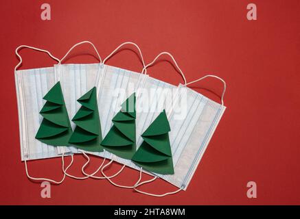 Closeup of a Christmas composition of medical masks and Christmas tree ...